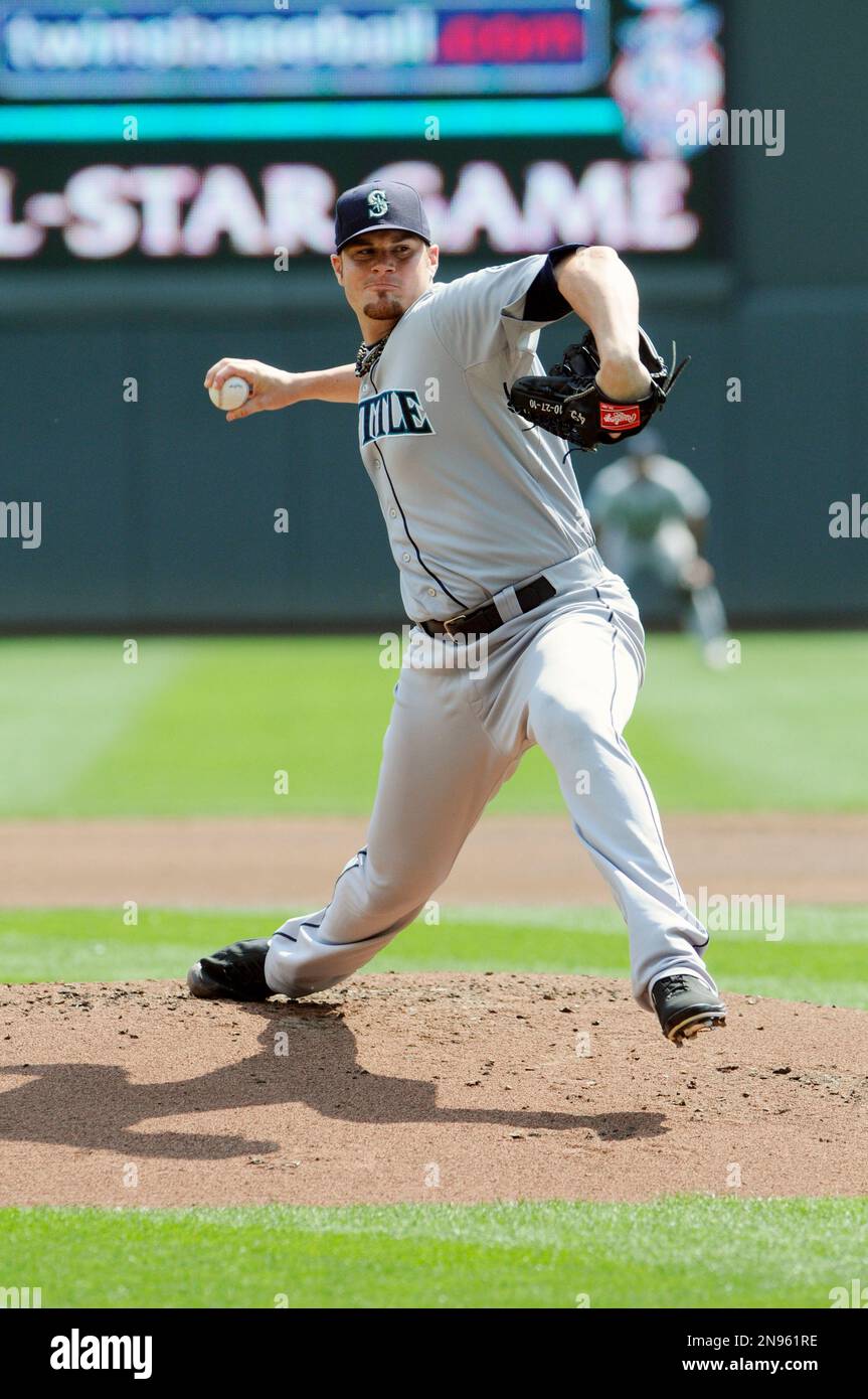 Seattle Mariners pitcher Blake Beavan throws against the Minnesota ...