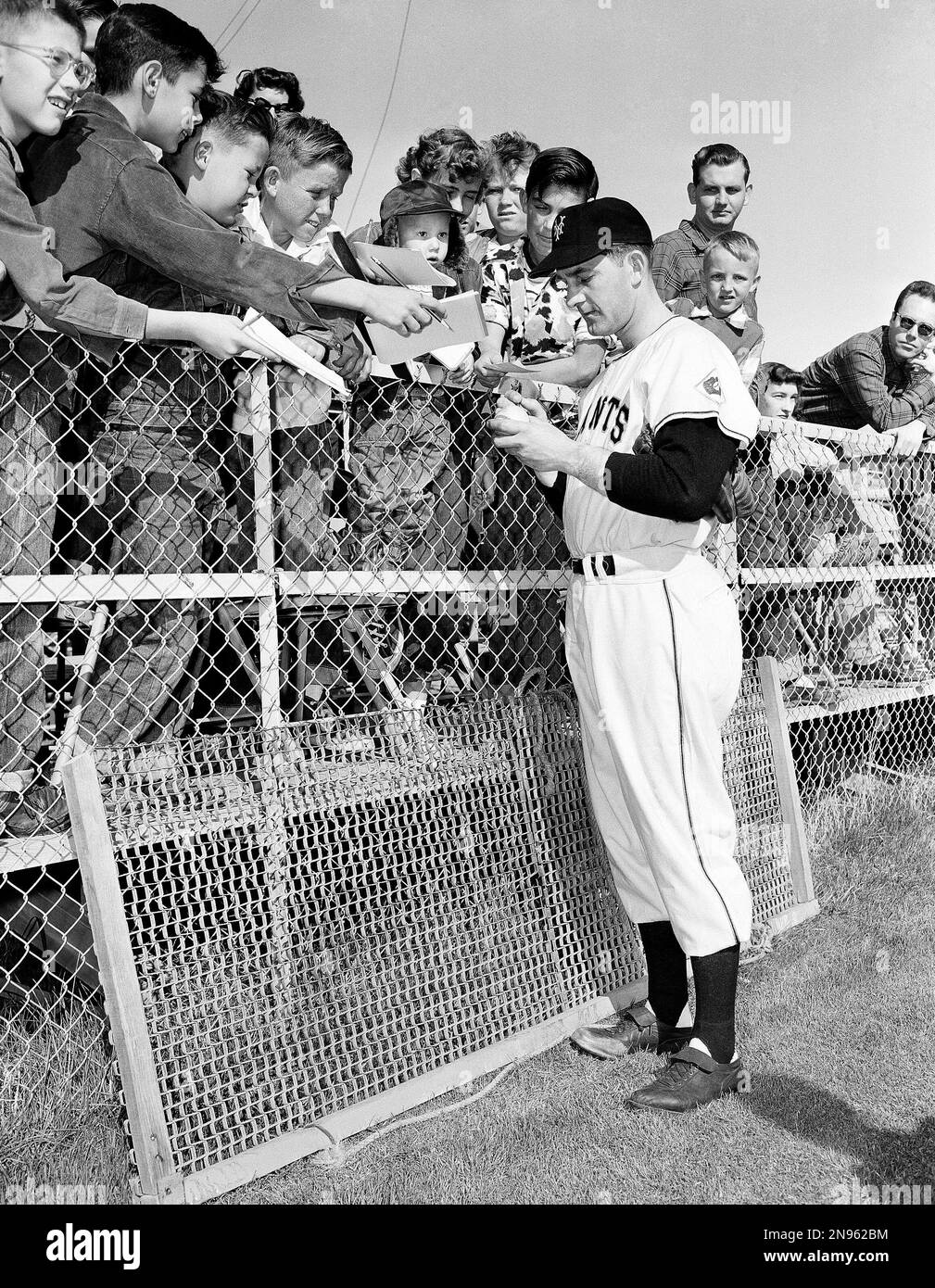 New York Giants pitcher Larry Jansen signs autographs for fans at ...