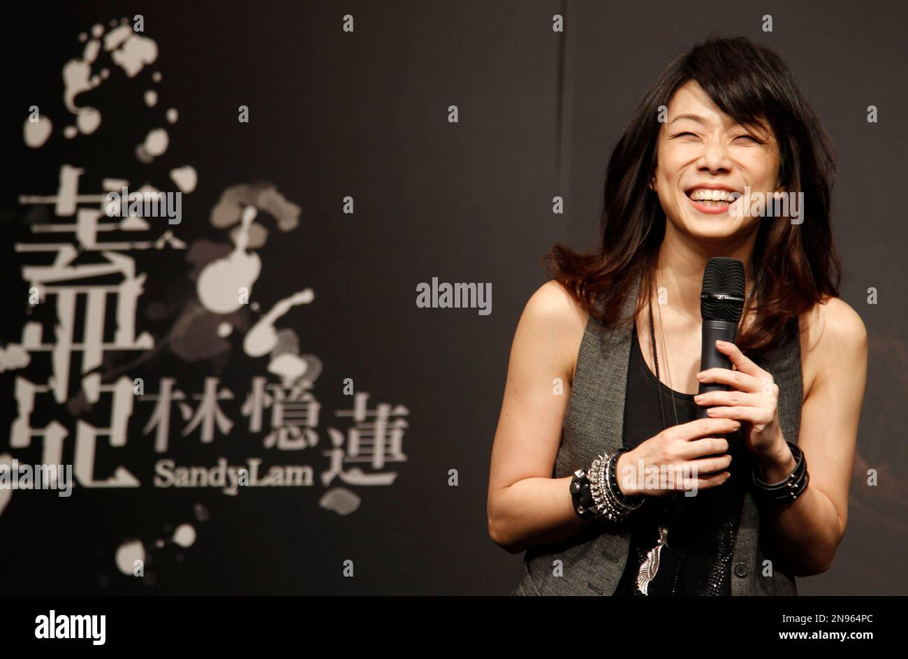 Hong Kong singer Sandy Lam attends a promotional event for her new ...