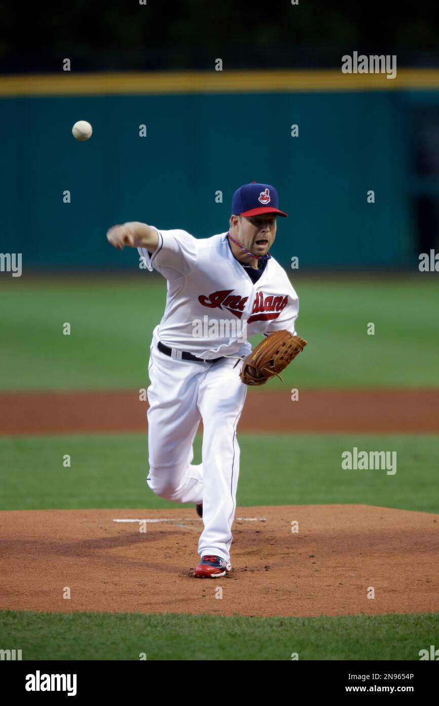 Cleveland Indians' Corey Kluber pitches against the Oakland Athletics ...