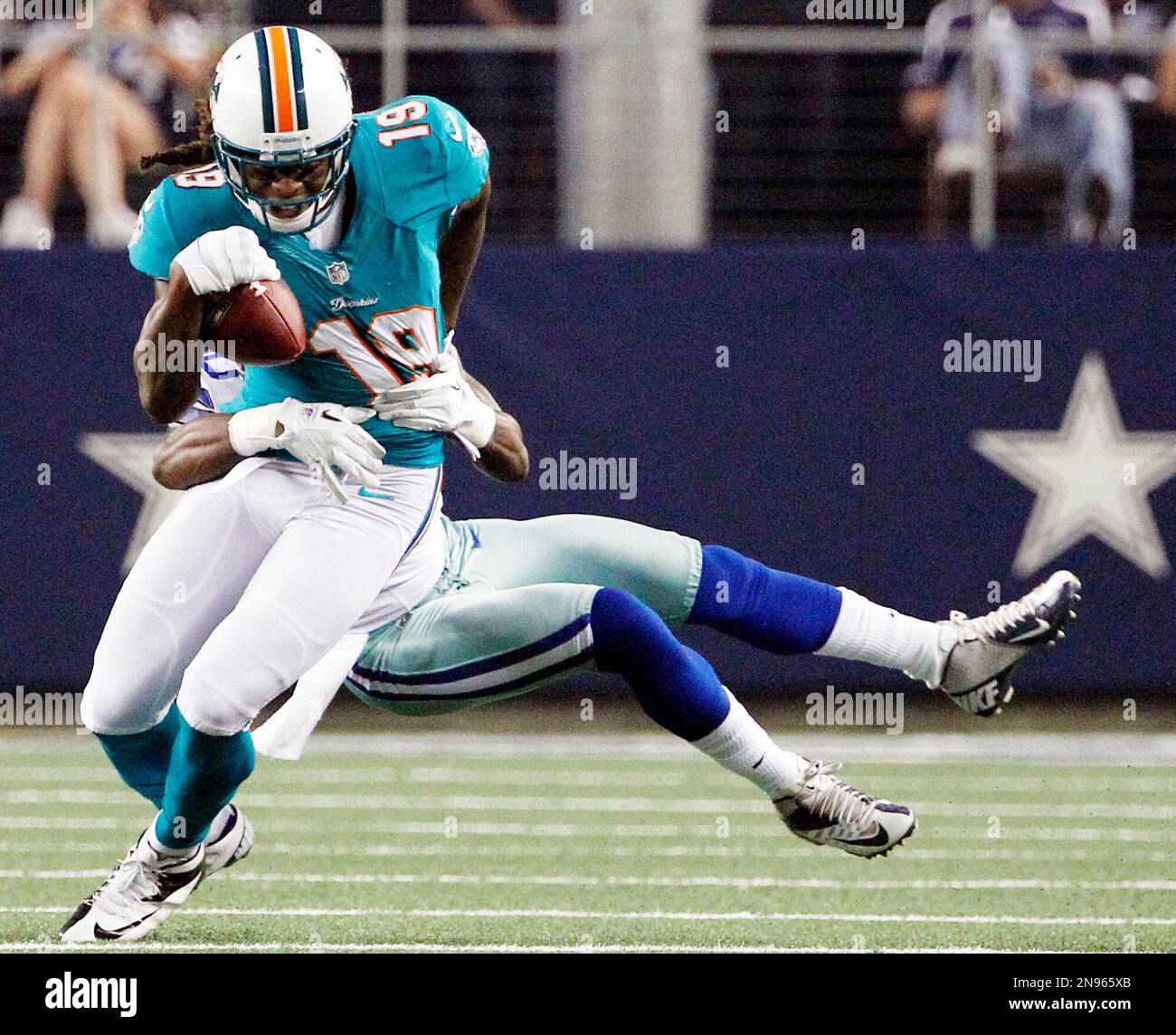 Dallas Cowboys cornerback Teddy Williams tackles Miami Dolphins wide ...