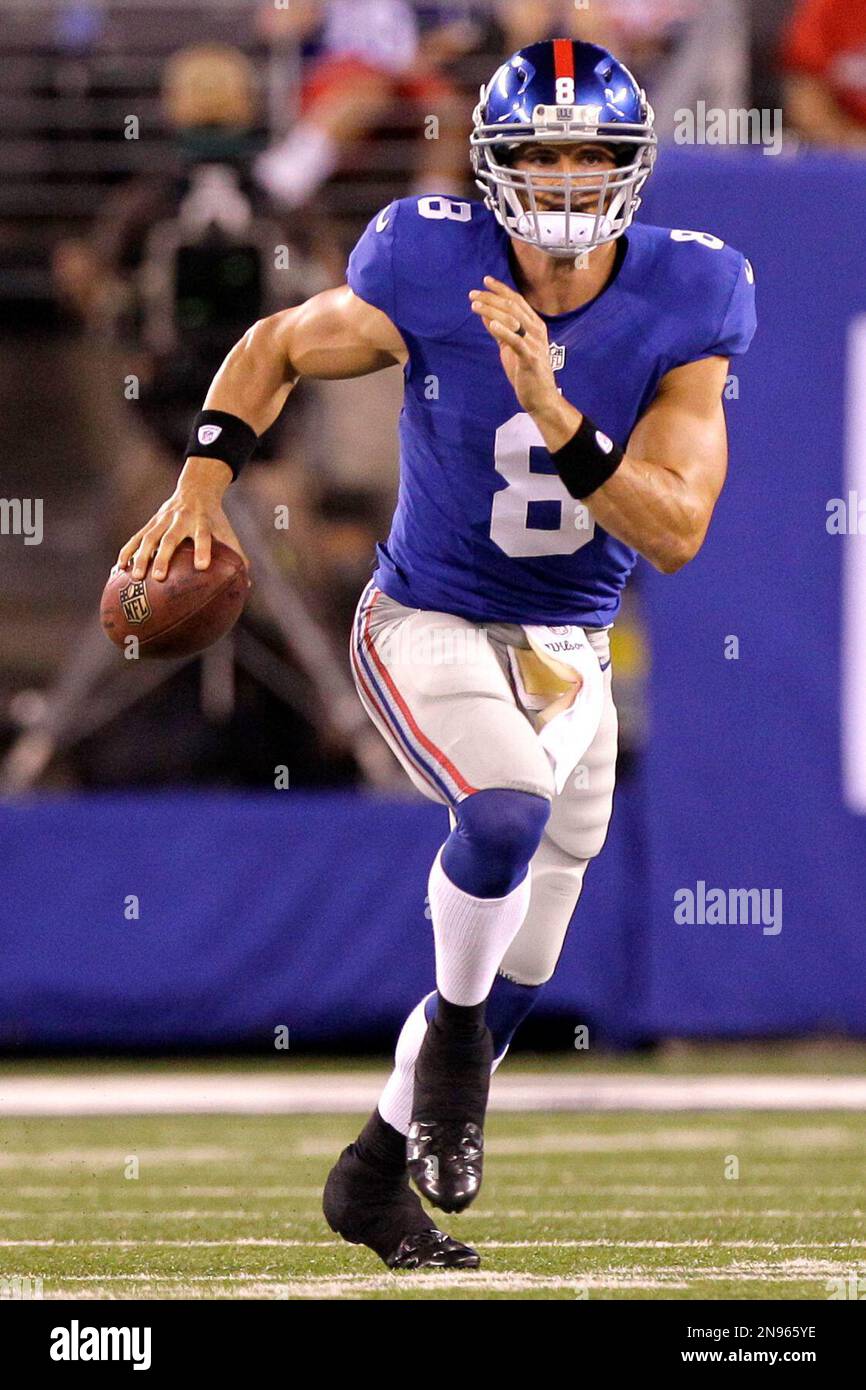 New York Giants quarterback David Carr runs with the ball against the ...