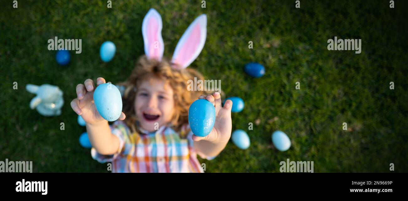 Cute child bunny wear rabbit ears in garden, Happy Easter day. Bunny ...