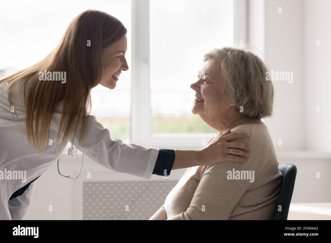 Cheerful practitioner woman visiting senior 80s female patient Stock ...