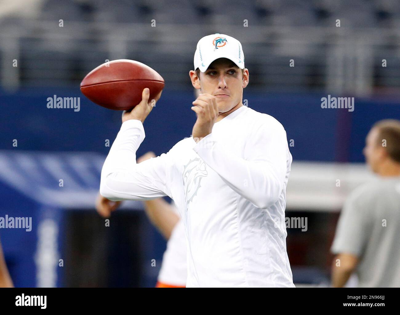 Miami Dolphins quarterback Pat Devlin warms up before a preseason NFL ...