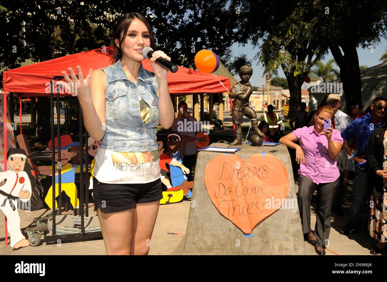 Mexican actress/singer Dulce Maria speaks at the ribbon-cutting for a ...