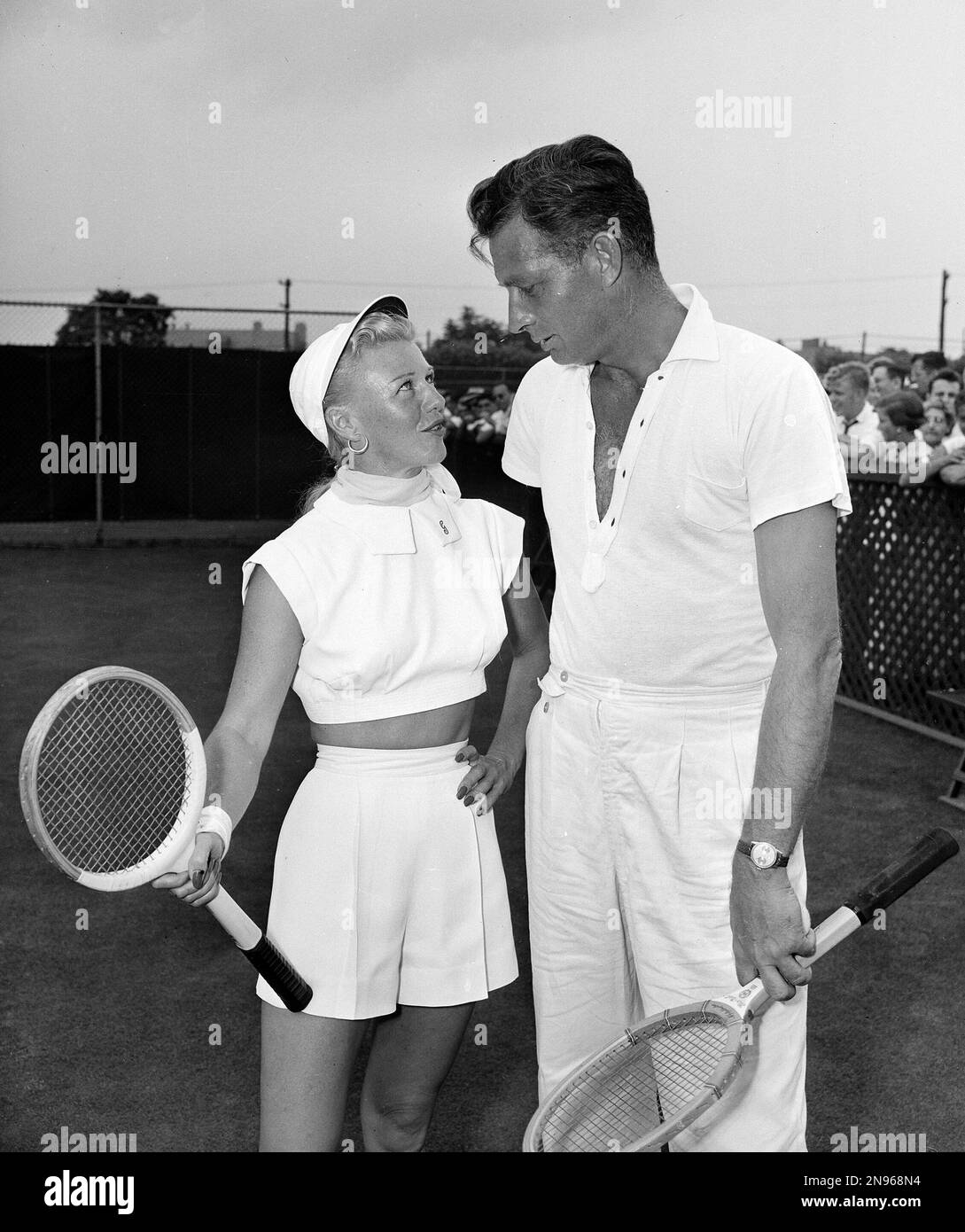 Film actress Ginger Rogers discusses tactics with her partner Frank ...
