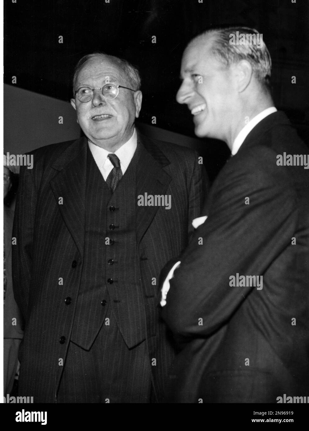 Prince Philip, Duke of Edinburgh, right, shares a joke with Sir Charles ...