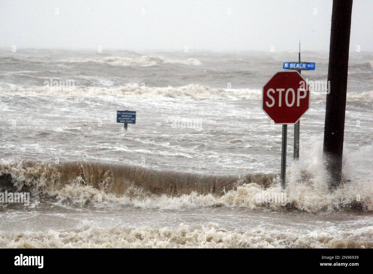 Isaac's winds and storm surge overcomes the seawall and floods Beach ...