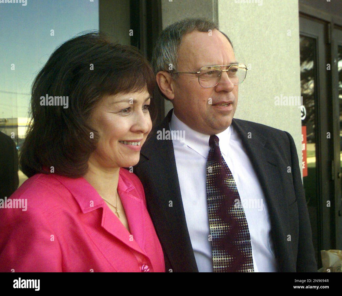 Elizabeth Sanders and her husband James Sanders talk to reporters ...