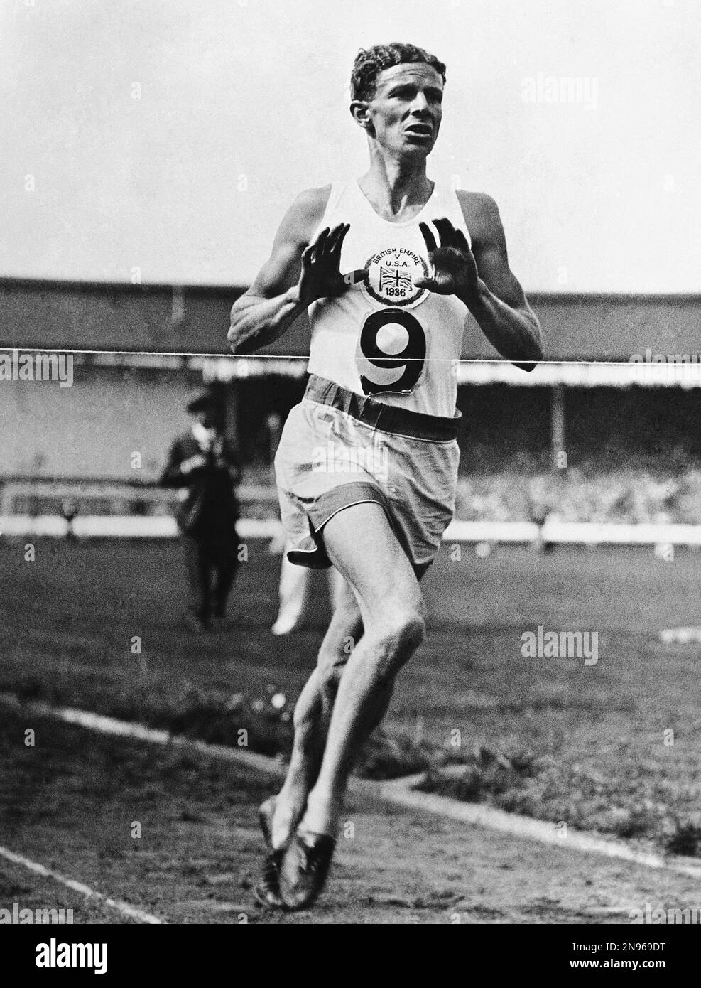 New Zealand athlete Jack Lovelock crossing the line first at the end of ...