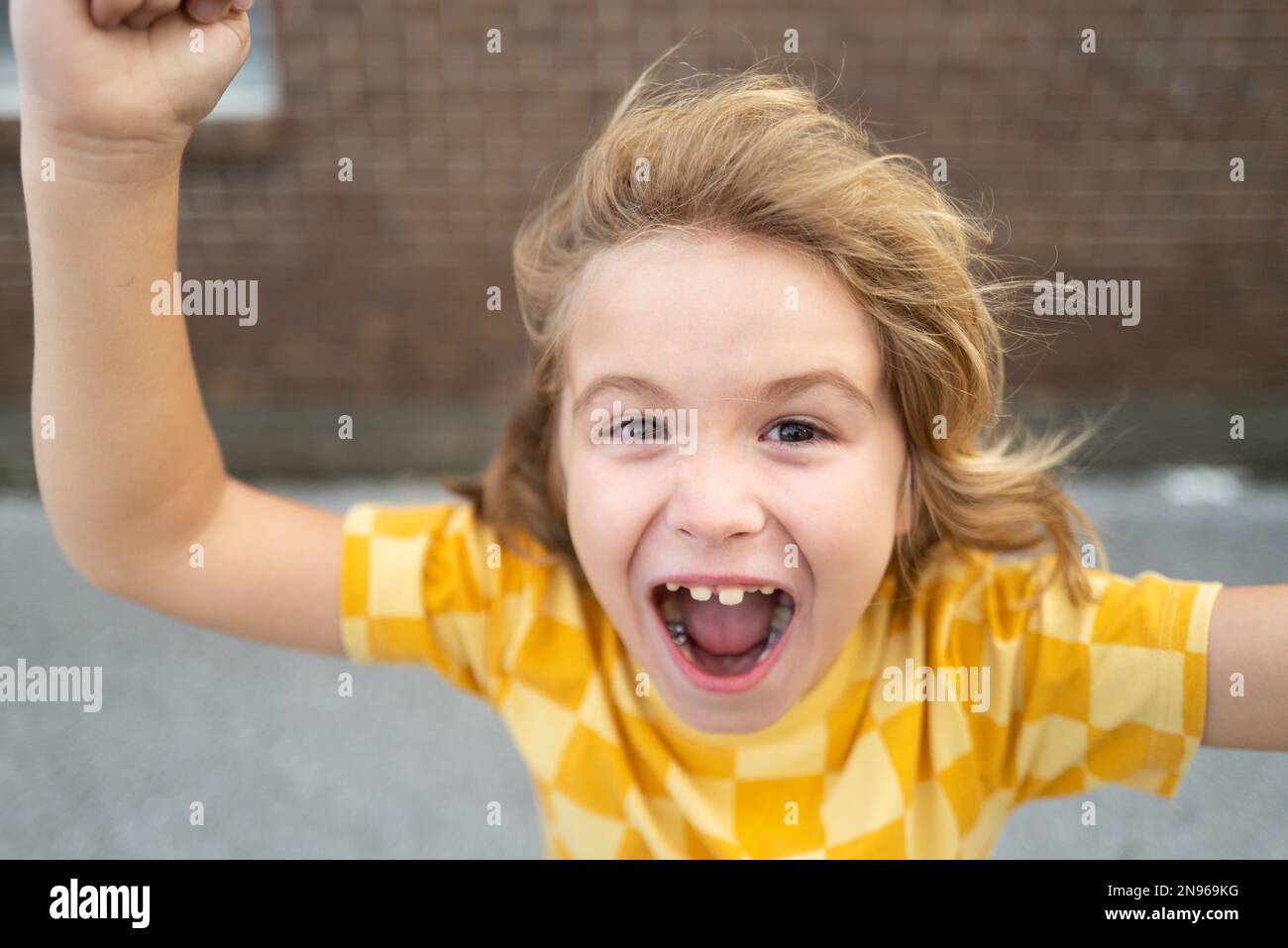 Enraged kid boy with angry expression. Angry hateful little aggression ...
