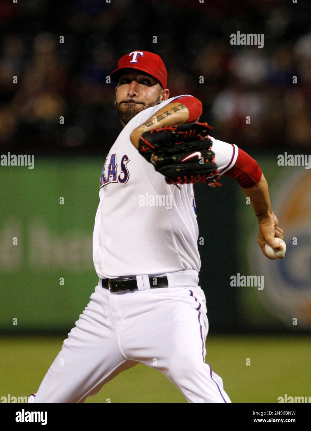 Texas Rangers relief pitcher Mike Adams (37) winds up to deliver to the ...