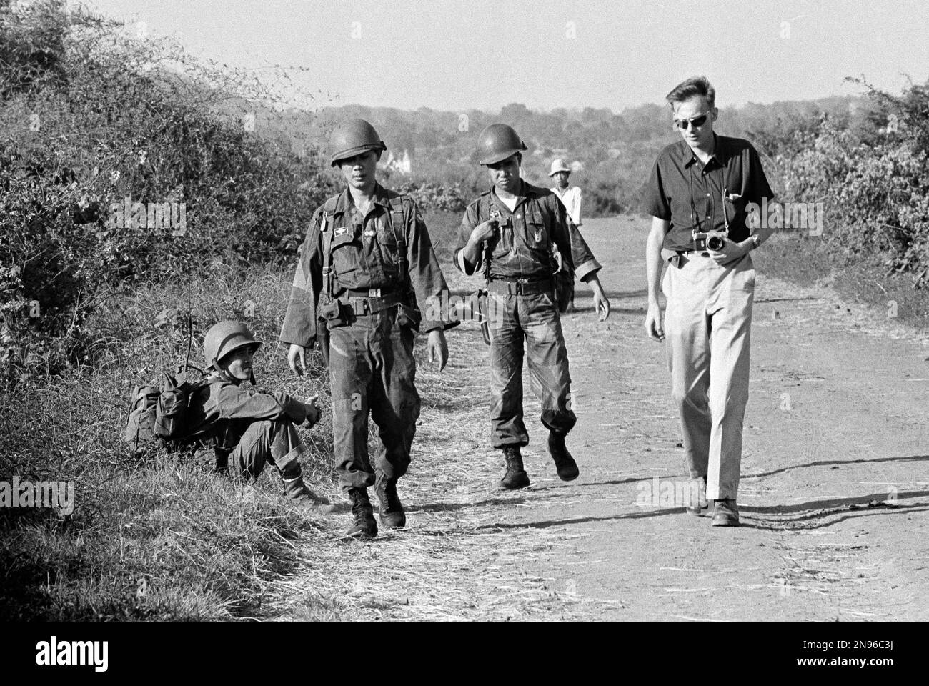 FILE - In this Jan. 7, 1965 file photo, AP Saigon correspondent Malcolm Browne goes on patrol ...