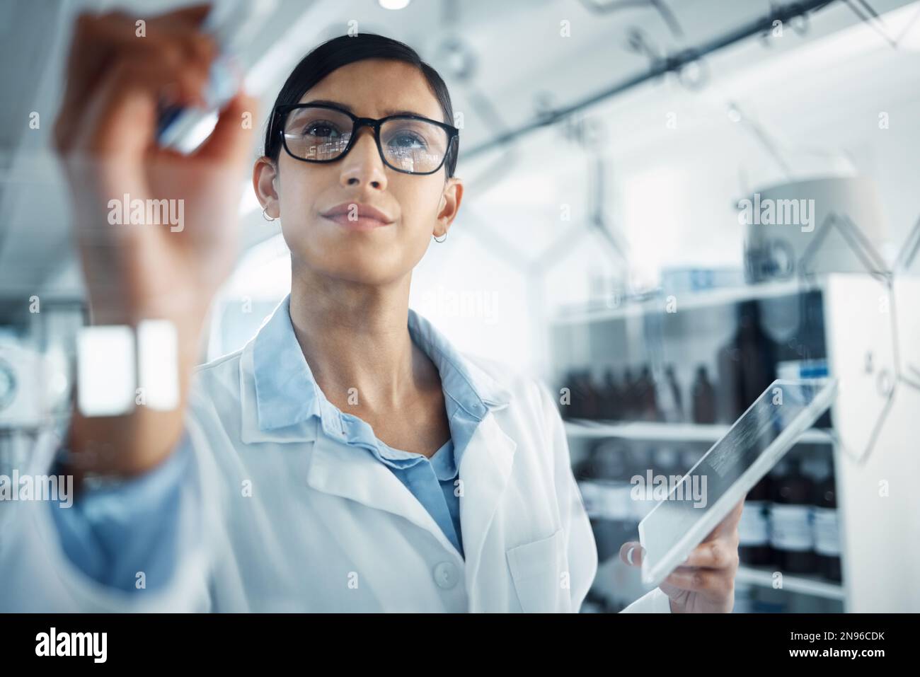 The formula for a no-fail life. a young scientist solving equations on ...