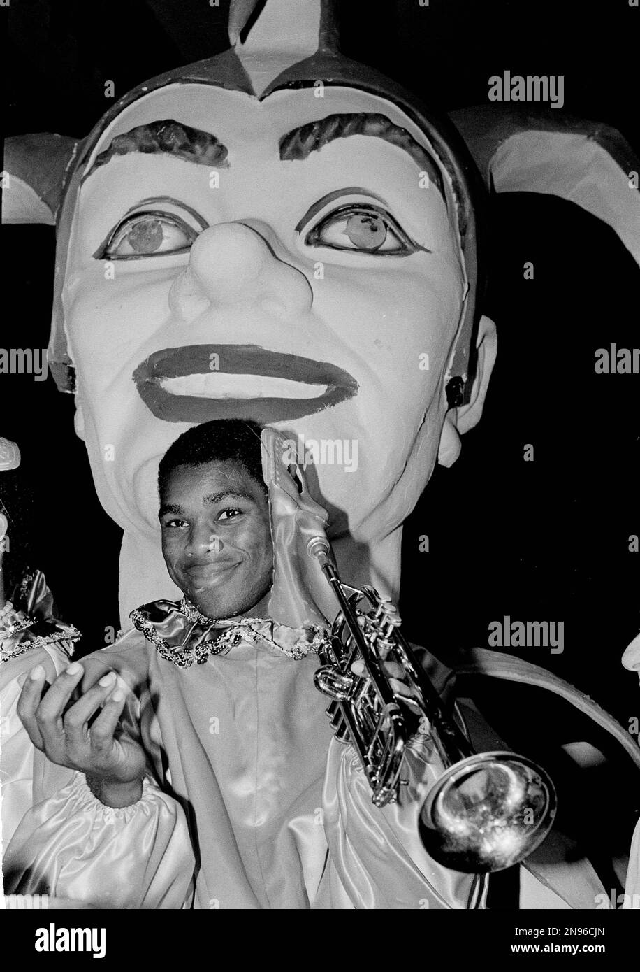 Heisman Trophy winner Herschel Walker of Georgia flips down his face ...