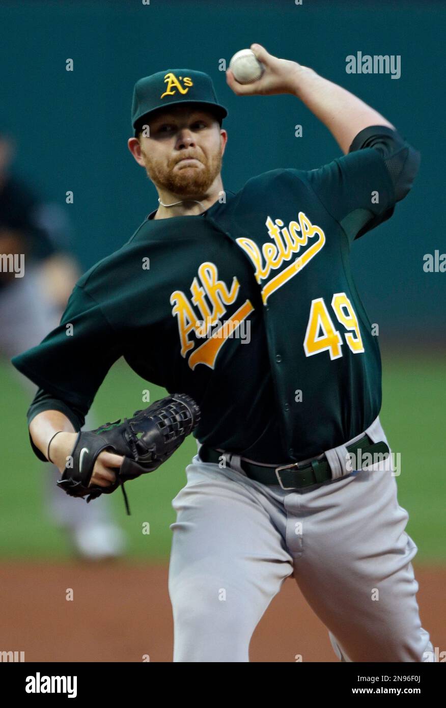 Oakland Athletics starting pitcher Brett Anderson delivers against the ...