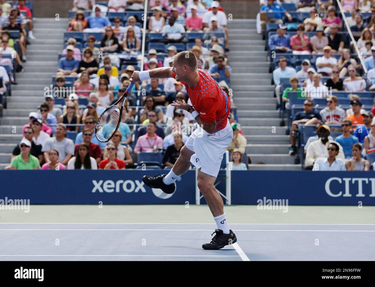 Alex Bogomolov Jr., of Russia, returns a shot to Britain's Andy Murray ...