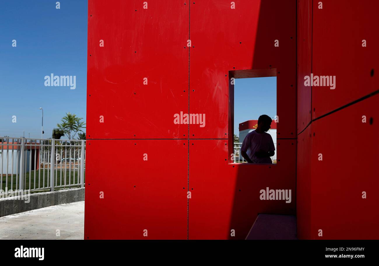 An Israeli high-school student stands in the window of a new ...