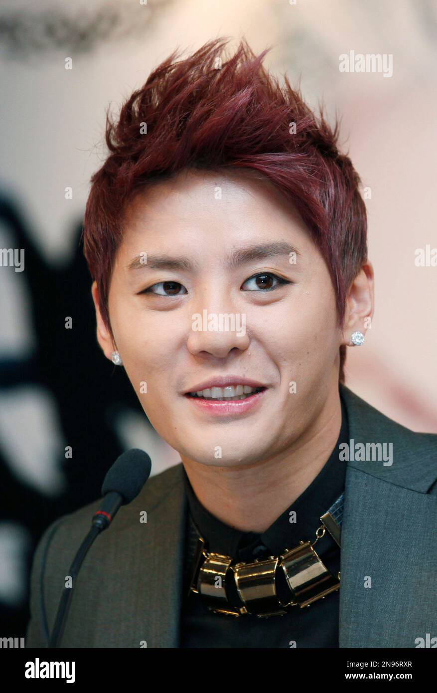 South Korean singer Kim Junsu poses at a news conference to promote his ...
