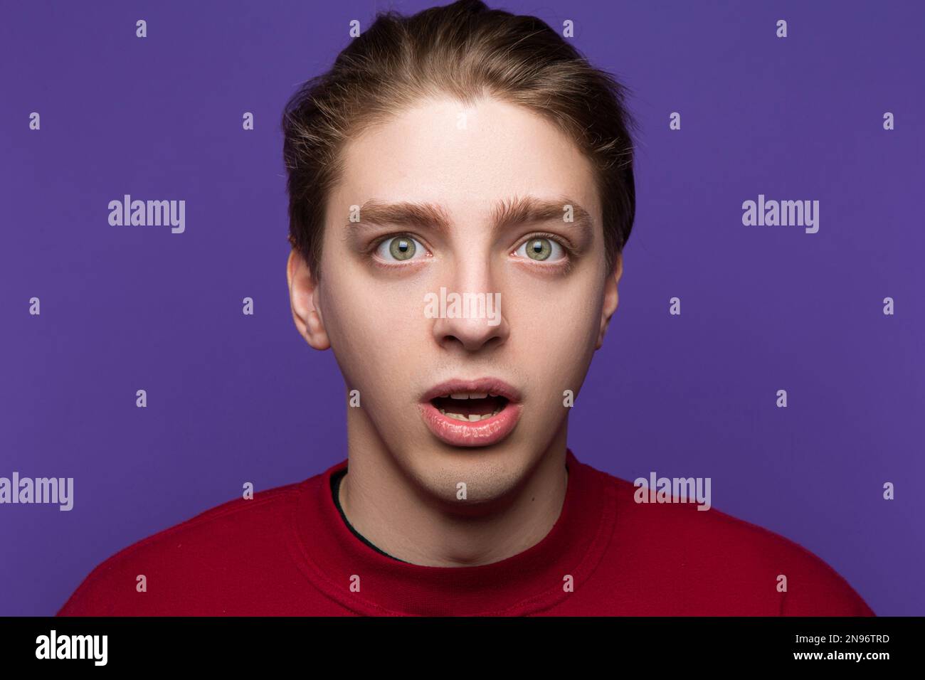 Astonished young male. Surprise emotion Stock Photo - Alamy