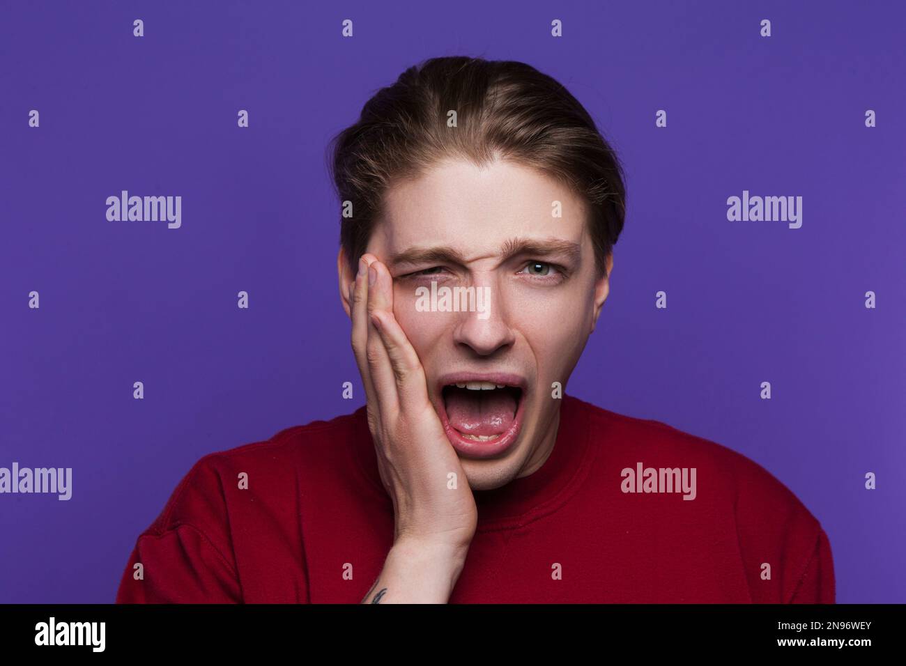 Young man got slap in face. Awkward seduction Stock Photo - Alamy