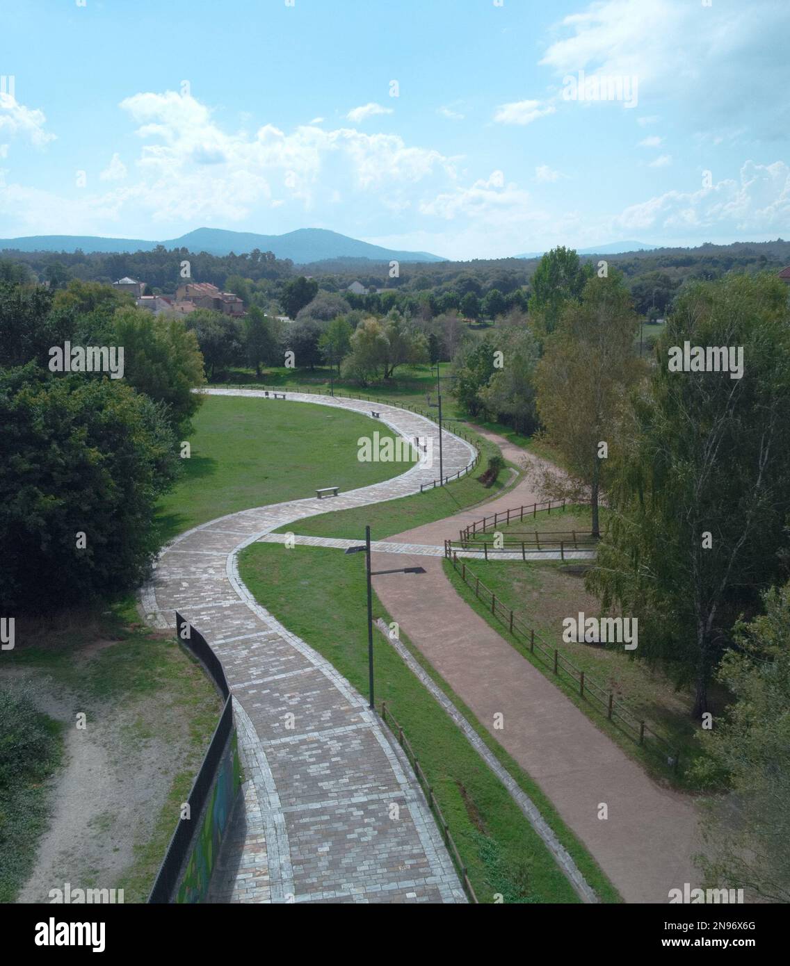 A vertical aerial view of pathways in a green park on a sunny day Stock ...
