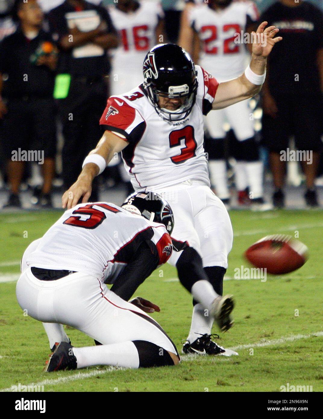 Atlanta Falcons' Matt Bosher (5) holds the ball as kicker Matt Bryant ...