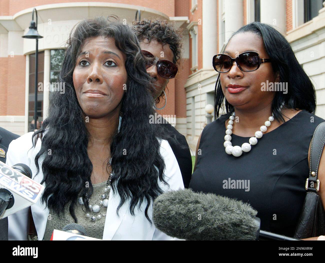Alice Williams, left, mother of Darrell Williams, talks about her son ...