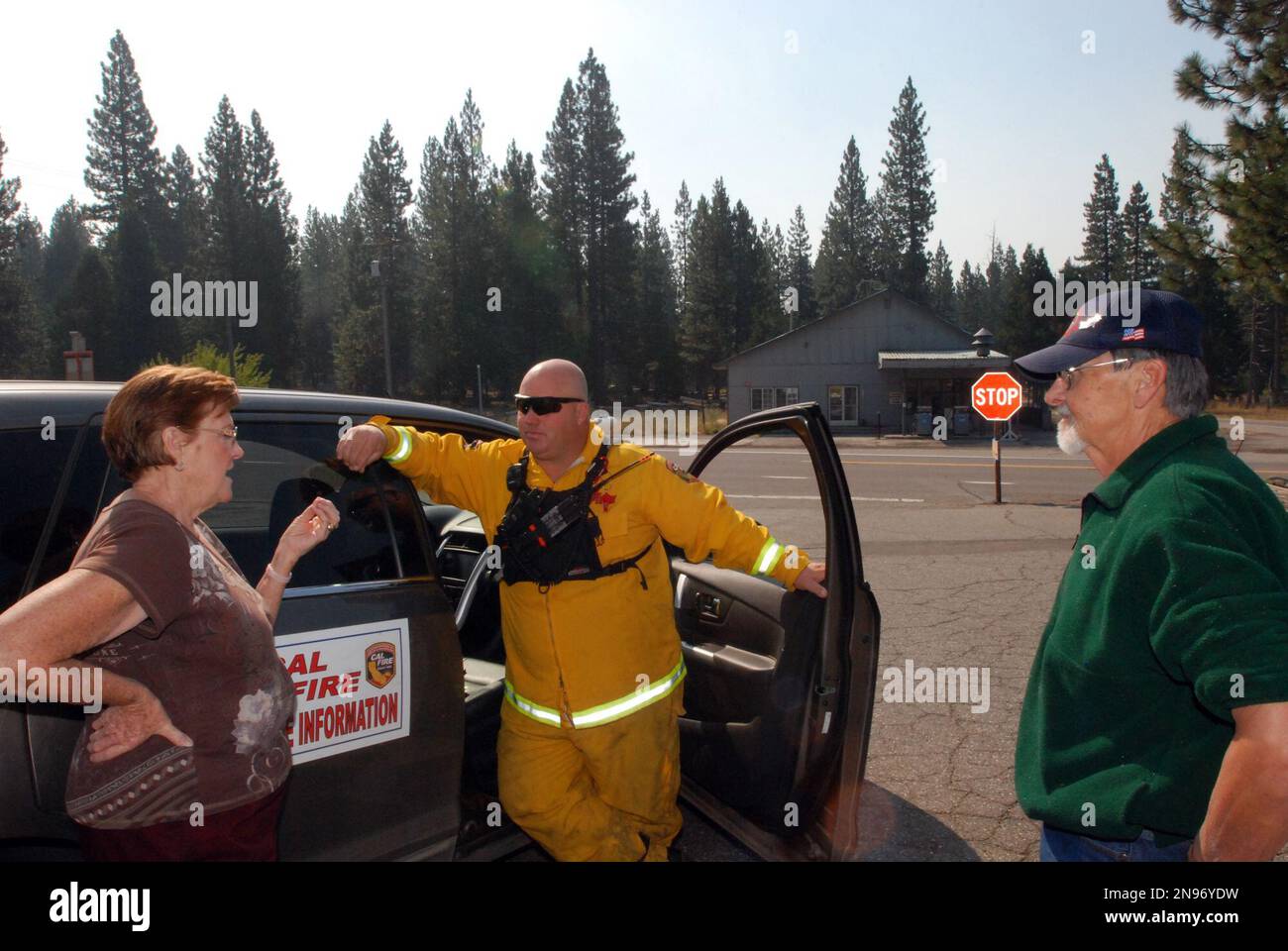Cal Fire information officer Don Camp, center, talks Friday, Aug. 24 ...