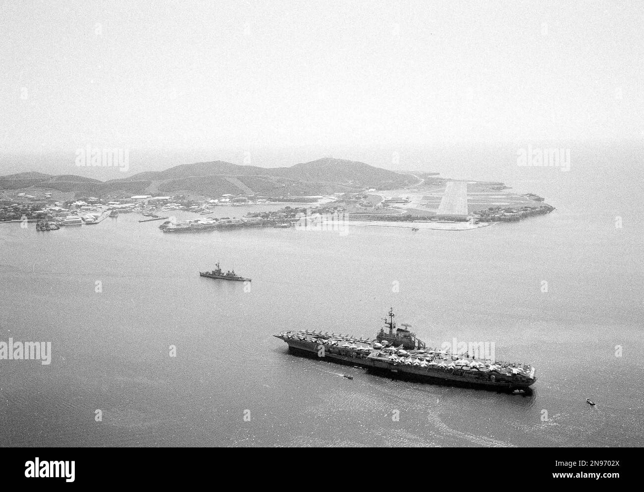 The aircraft carrier USS Franklin D. Roosevelt dominates this air view ...
