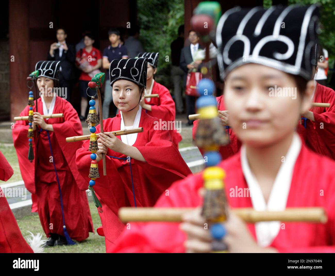 South Korean students wearing traditional Korean costumes perform ...