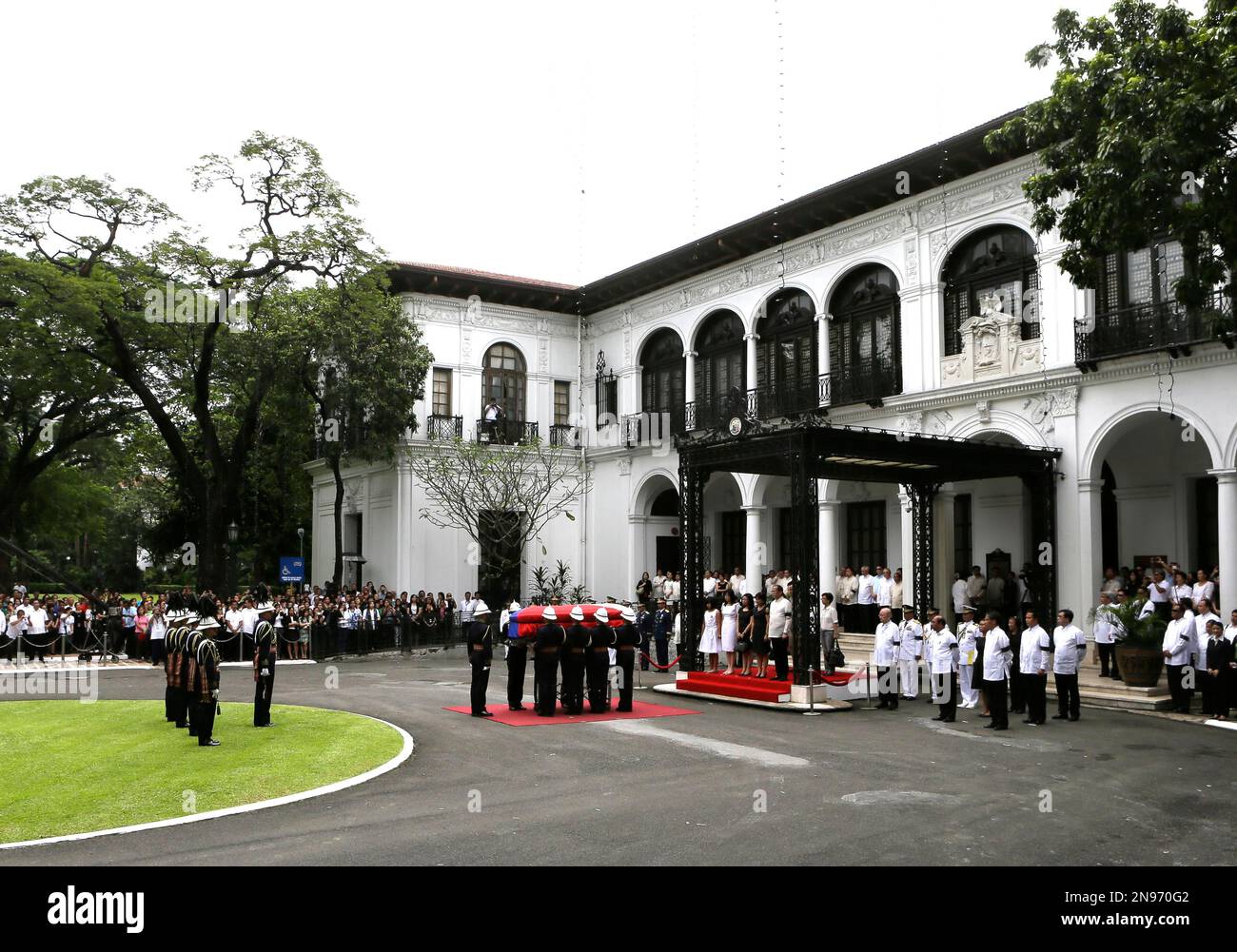 Presidential guards carry the flag-draped coffin of the late Interior ...