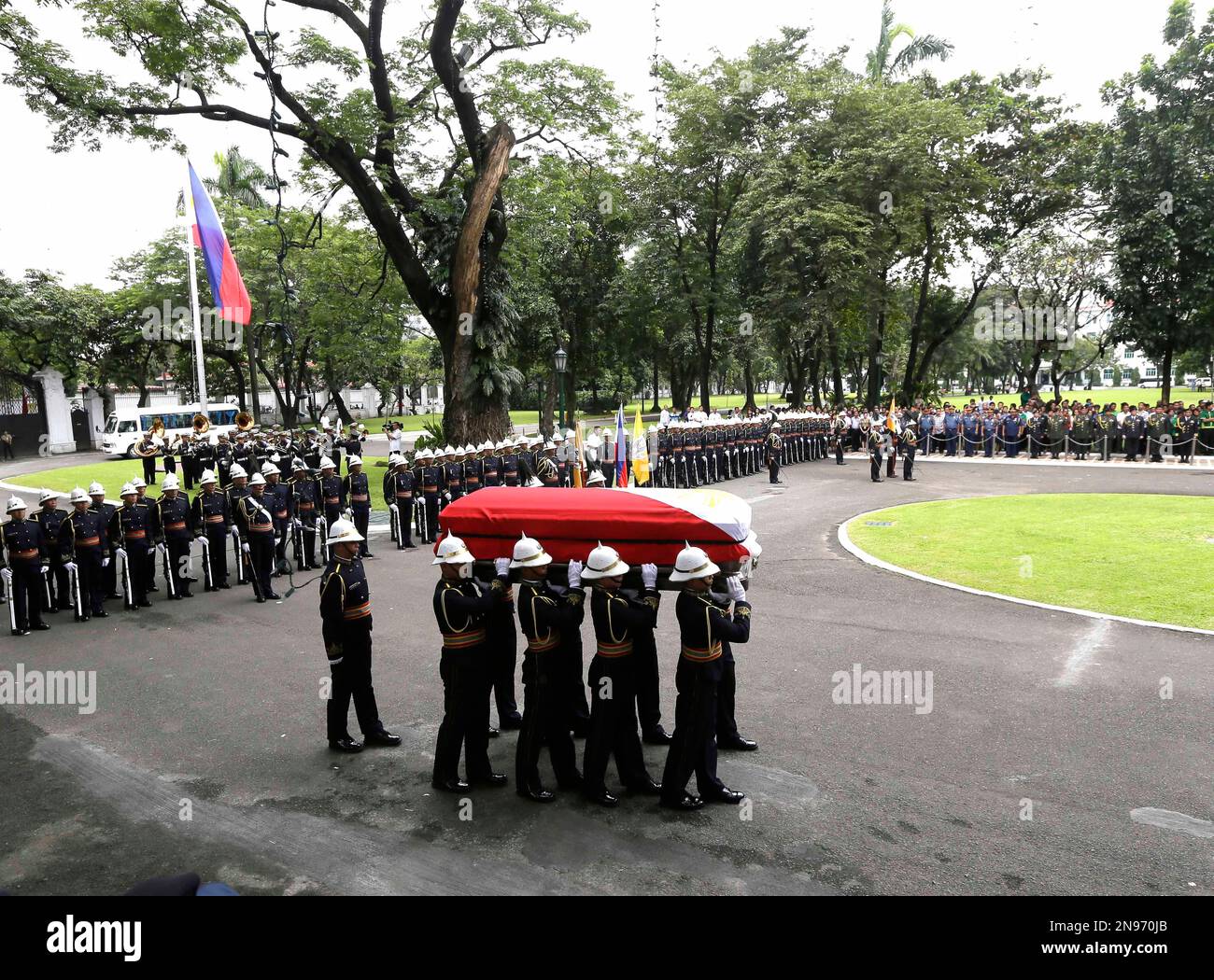 Presidential guards carry the flag-draped coffin of the late Interior ...