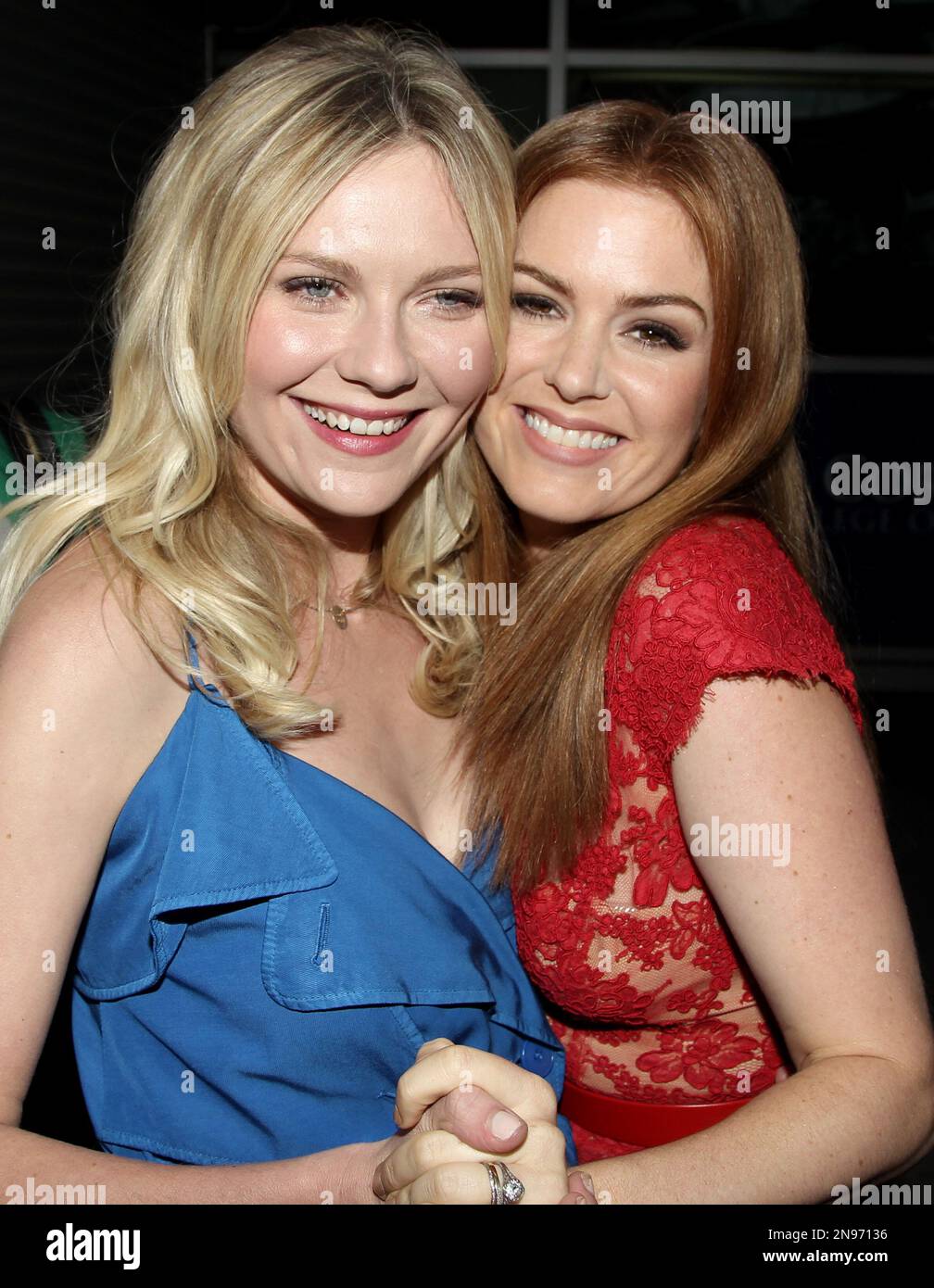 Cast members Kirsten Dunst, left, and Isla Fisher pose together at the ...