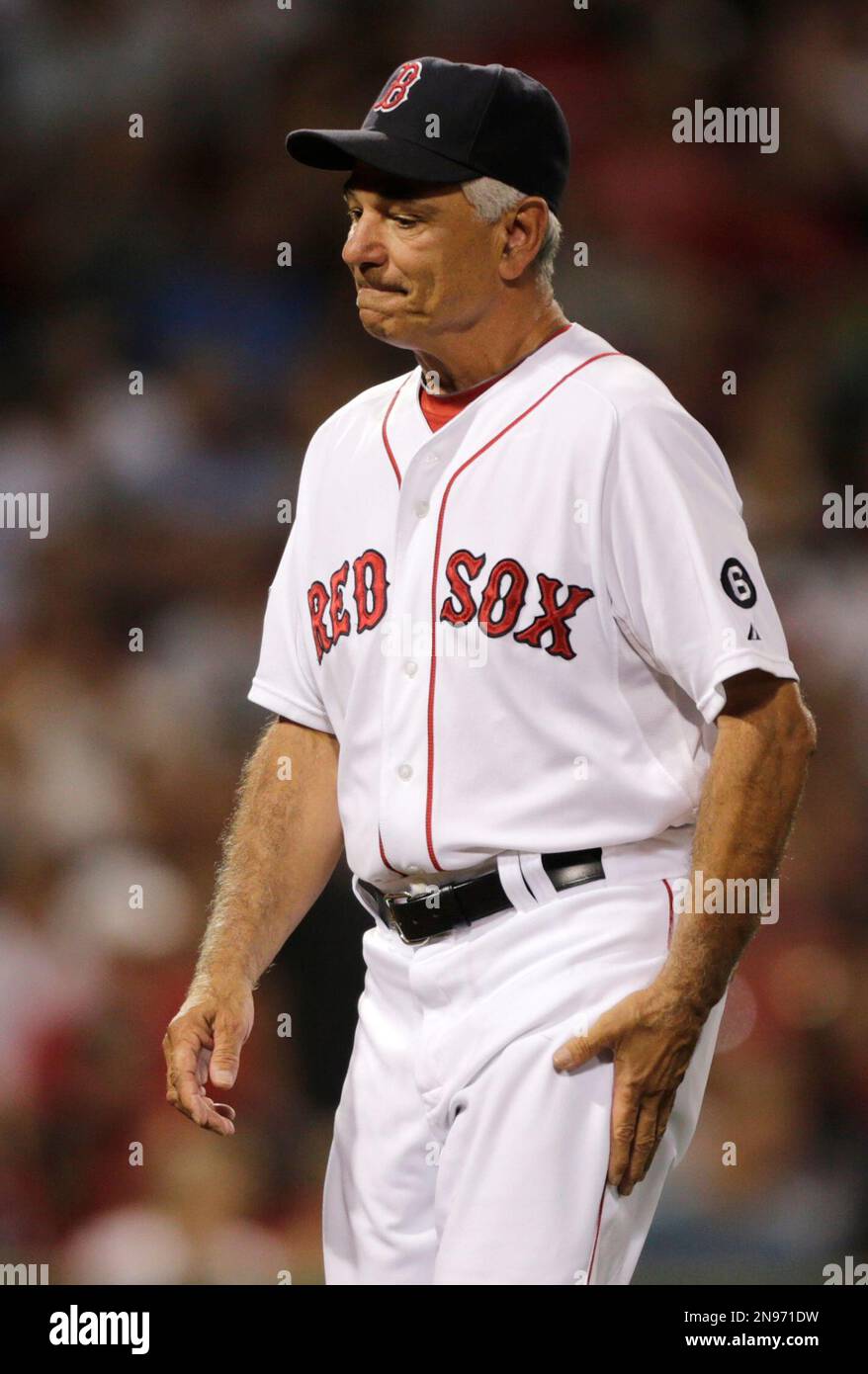 Boston Red Sox manager Bobby Valentine walks back to the dugout during ...