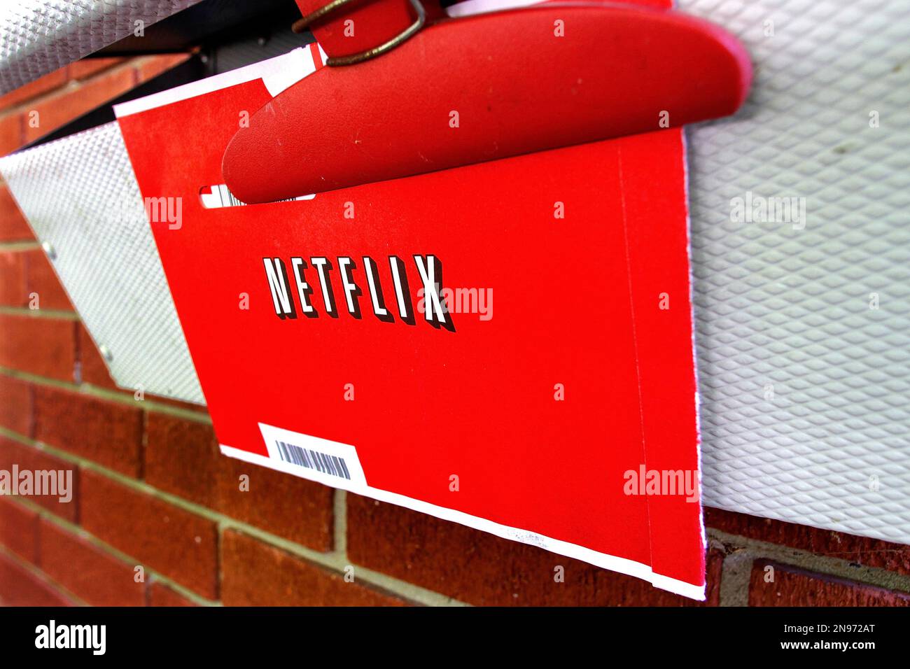 A Netflix envelop containing a DVD to be returned by mail is clipped ...