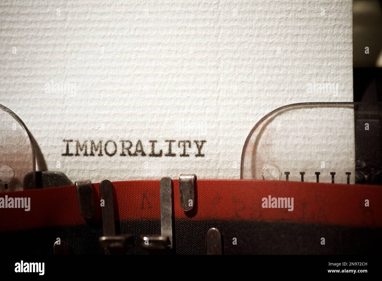 Immorality word written with a typewriter Stock Photo - Alamy
