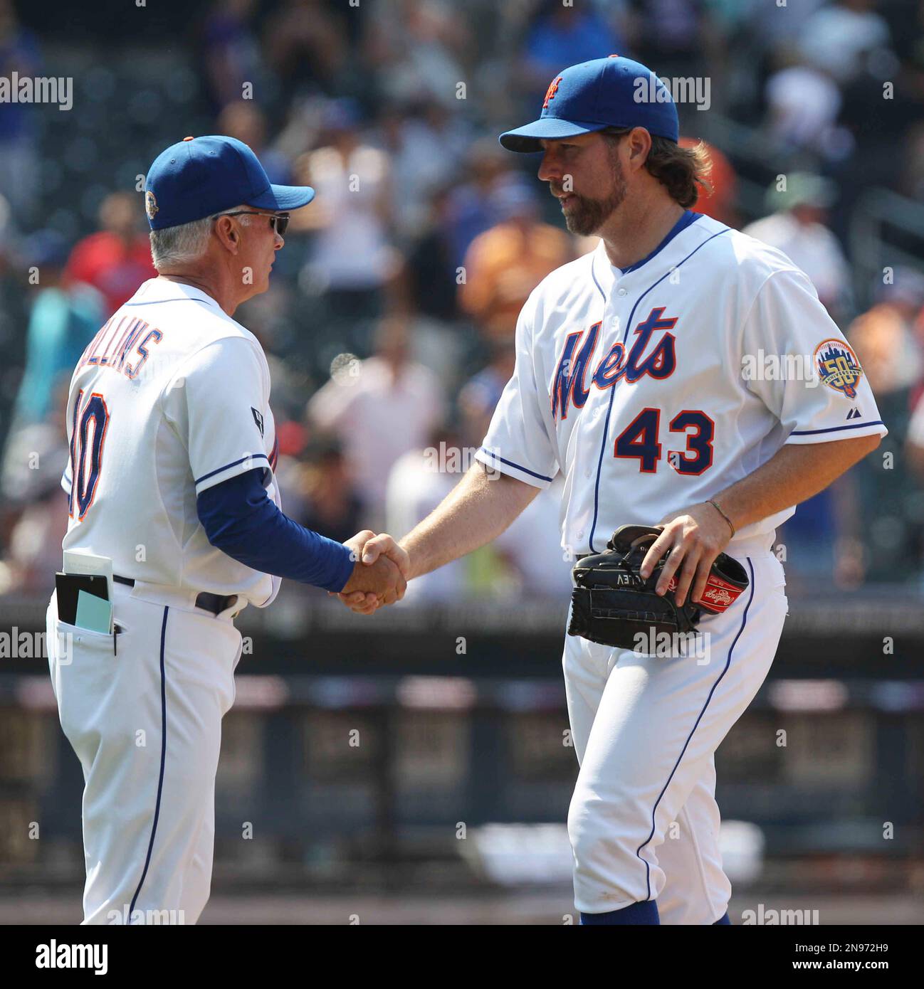 New Mets pitcher R.A. Dickey greets manager Terry Collins after the ...