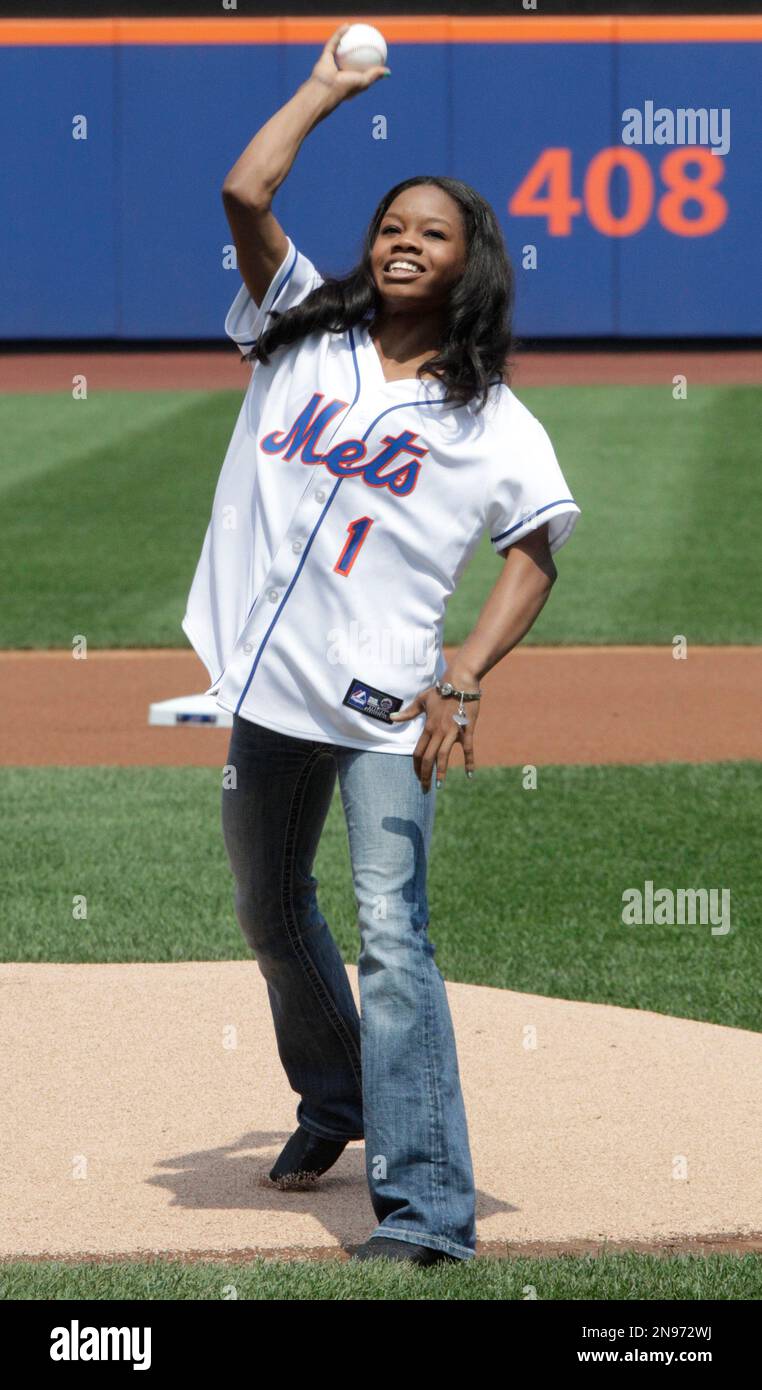 Olympic gold medal gymnast Gabrielle Douglas throws out the ceremonial ...