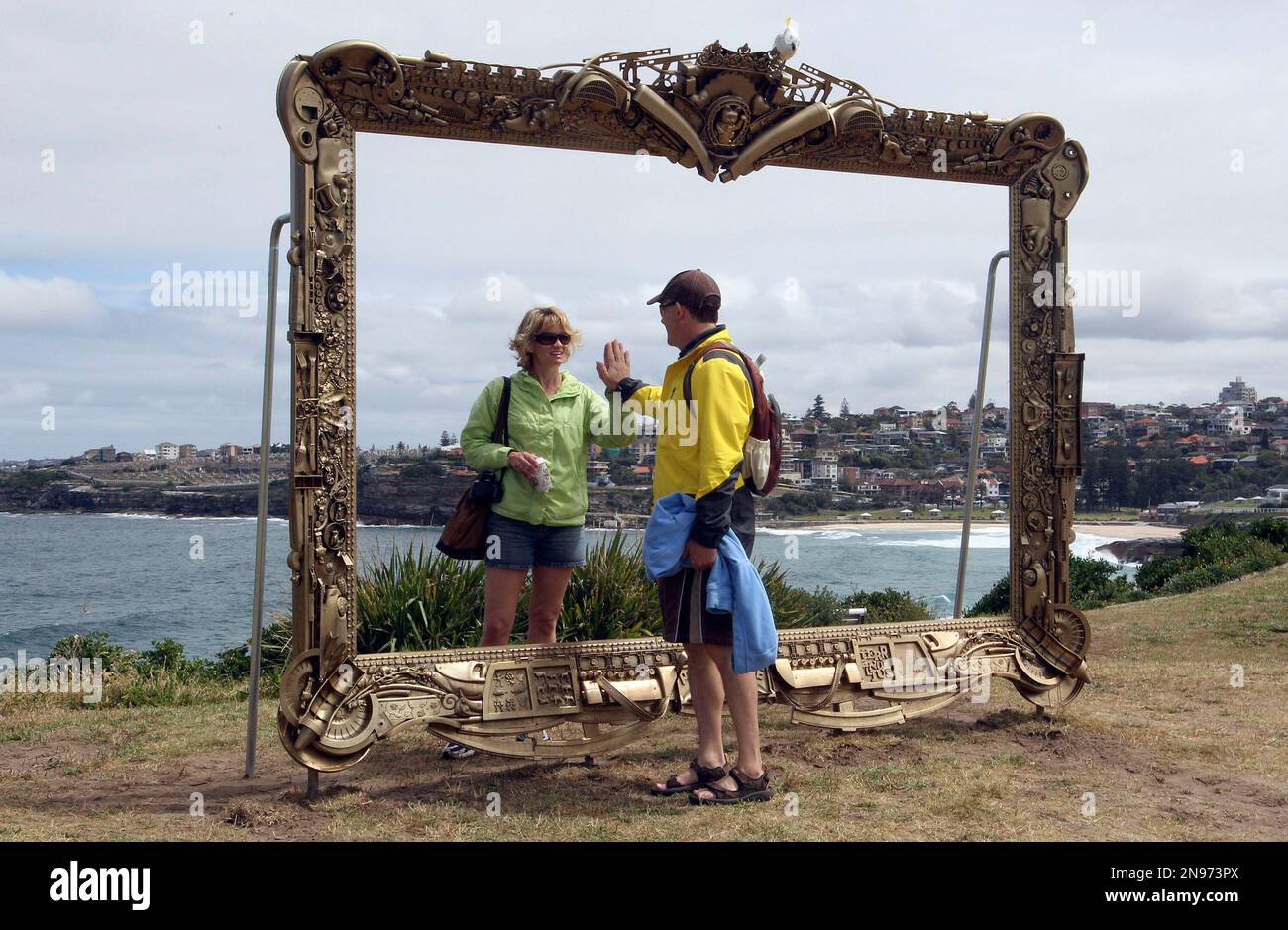 In this Nov. 3, 2011 file photo, a couple pretend to be a mirror image ...