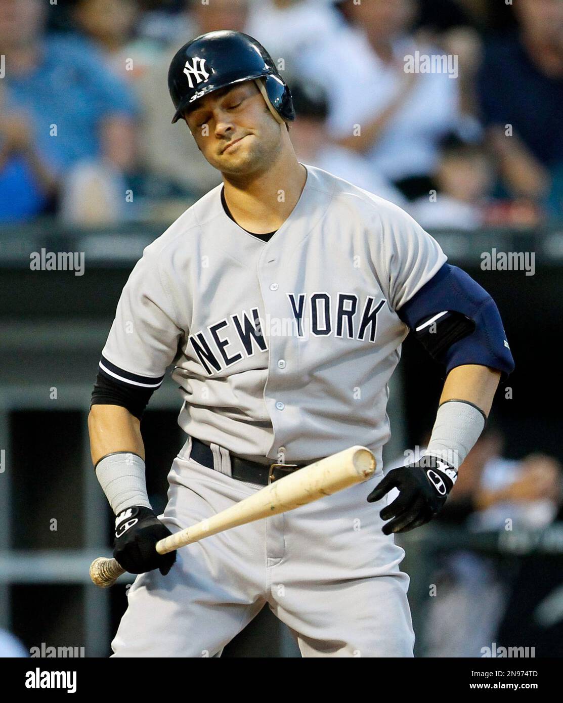 New York Yankees' Nick Swisher reacts after striking out against the ...
