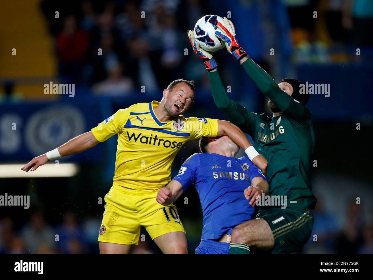 Reading's Noel Hunt, left, catches Chelsea's Gary Cahill, center, in ...