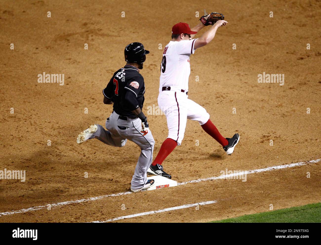 Miami Marlins' Jose Reyes is out at first as Arizona Diamondbacks ...