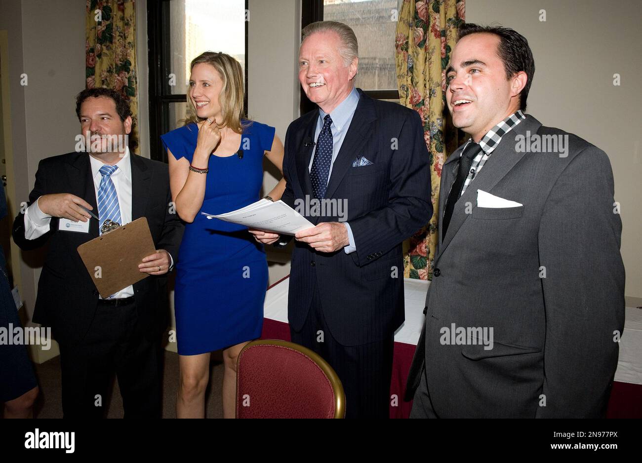Television personality Liza Fromer, centre, and actor Jon Voight pose ...