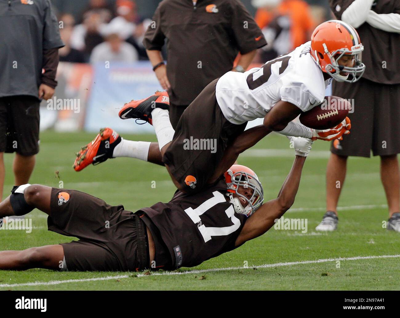 Cleveland Browns cornerback Trevin Wade, top, breaks up a pass for wide ...