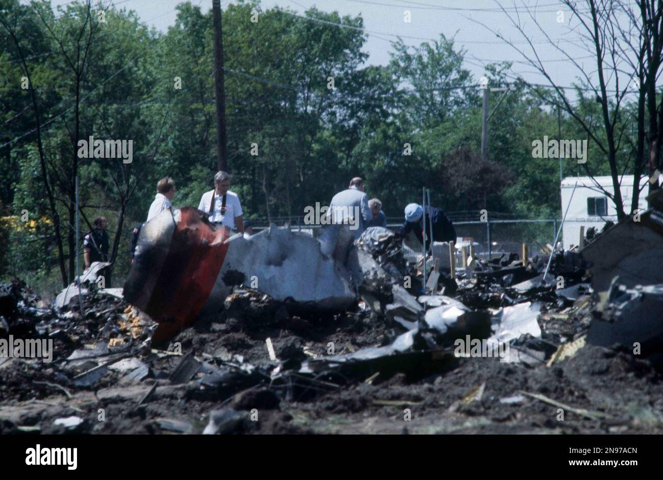 Investigators view the wreckage of the ill-fated American Airlines ...