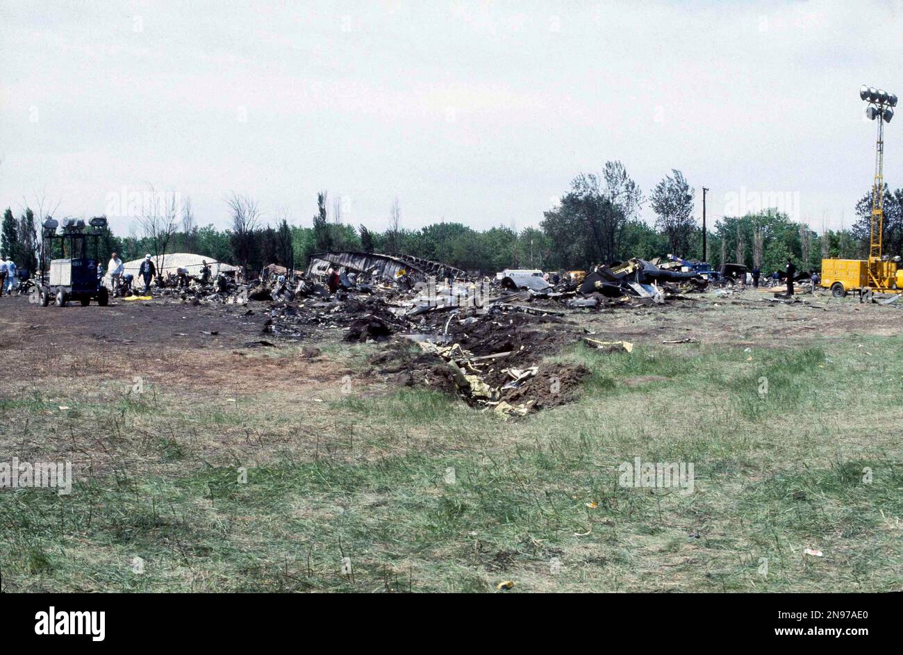 Investigators view the wreckage of the ill-fated American Airlines ...