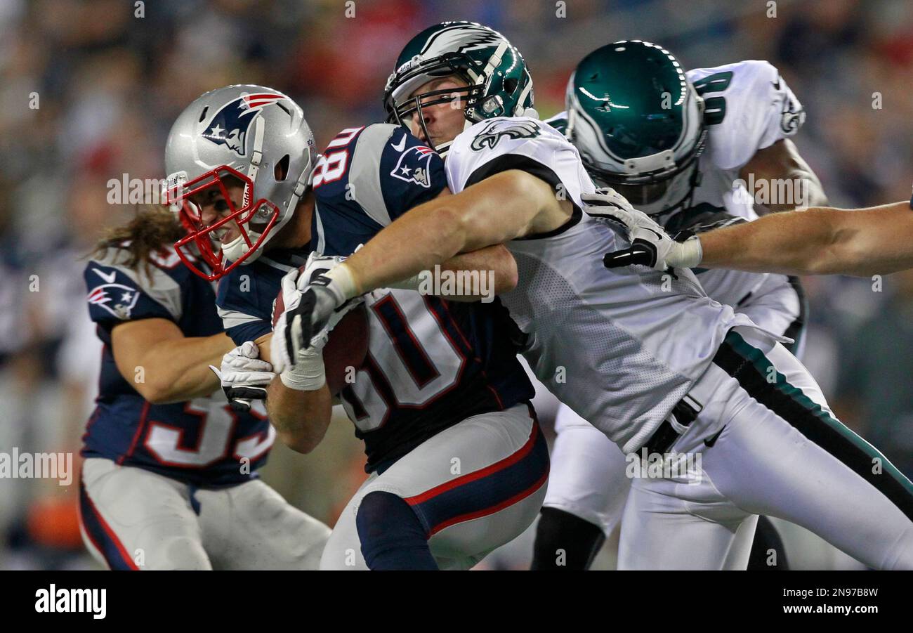 Philadelphia Eagles linebacker Ryan Rau (47) hangs onto New England ...