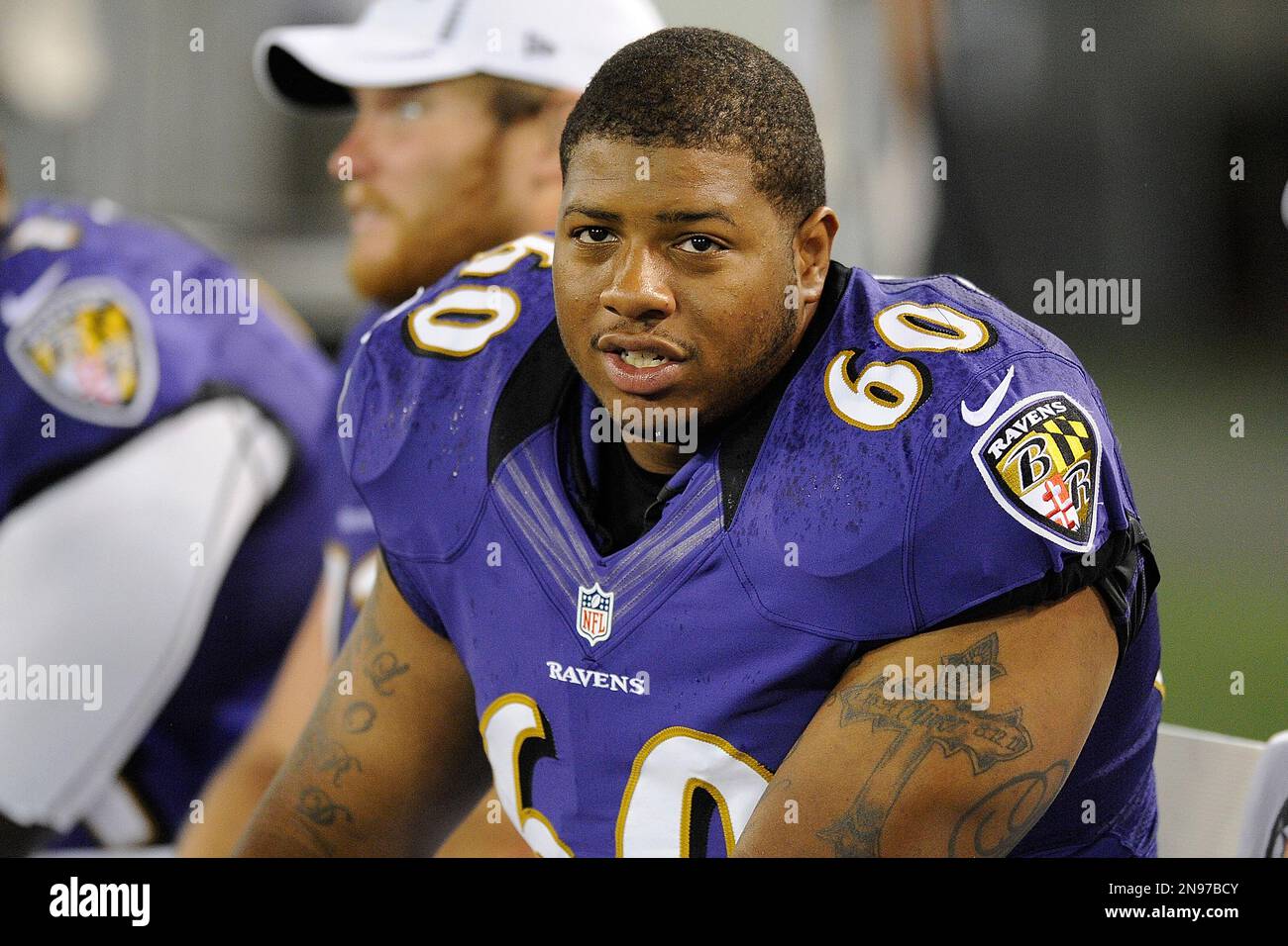 Baltimore Ravens guard Antoine McClain (60) watches the action from the ...
